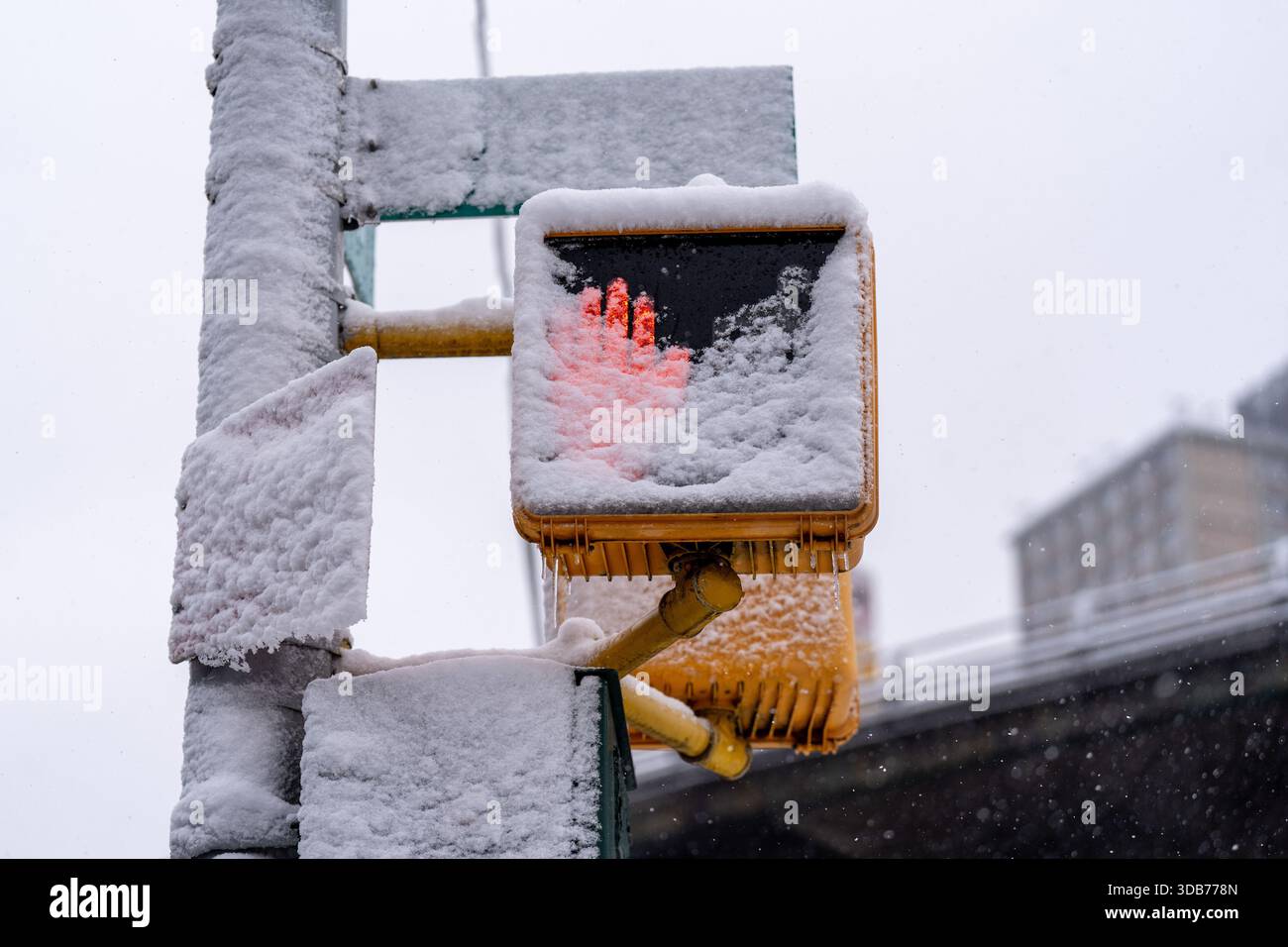 A crossing sign is covered in snow after snow fall, Sunday, Dec. 14 ...