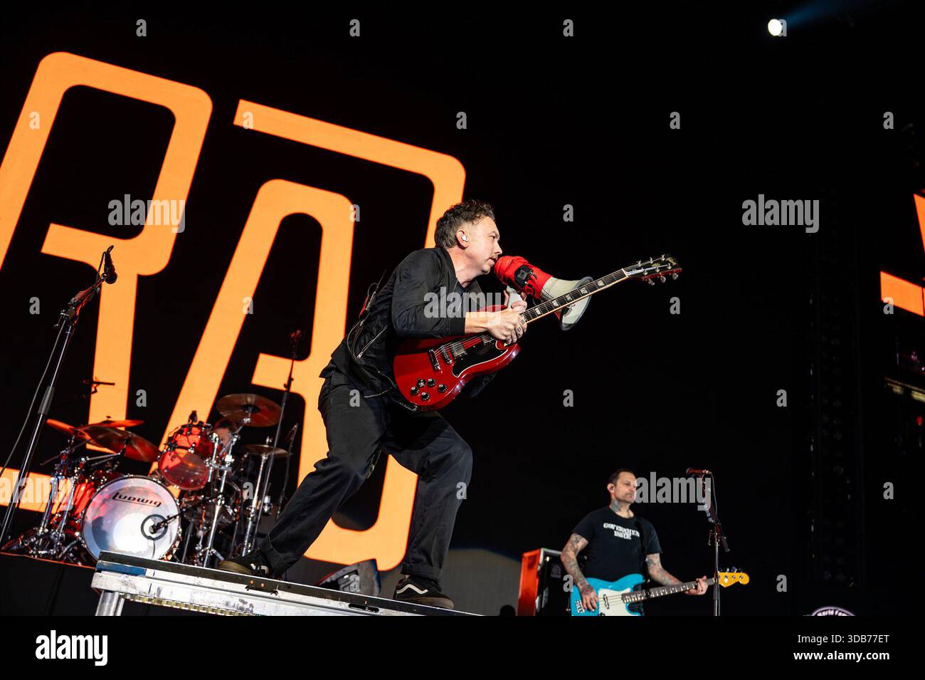 Rise Against - Tim McIlrath, Joe Principe perform onstage during the ...