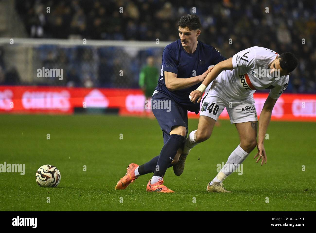 Genk's Robin Mirisola and Westerlo's Emin Bayram fight for the ball ...