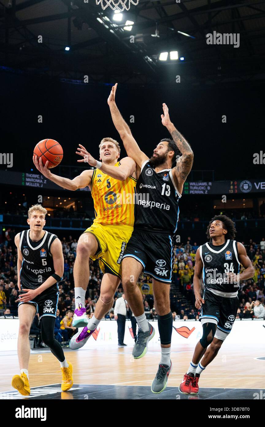Sam Griesel (ALBA Berlin, #05) performing a layup against Martin ...
