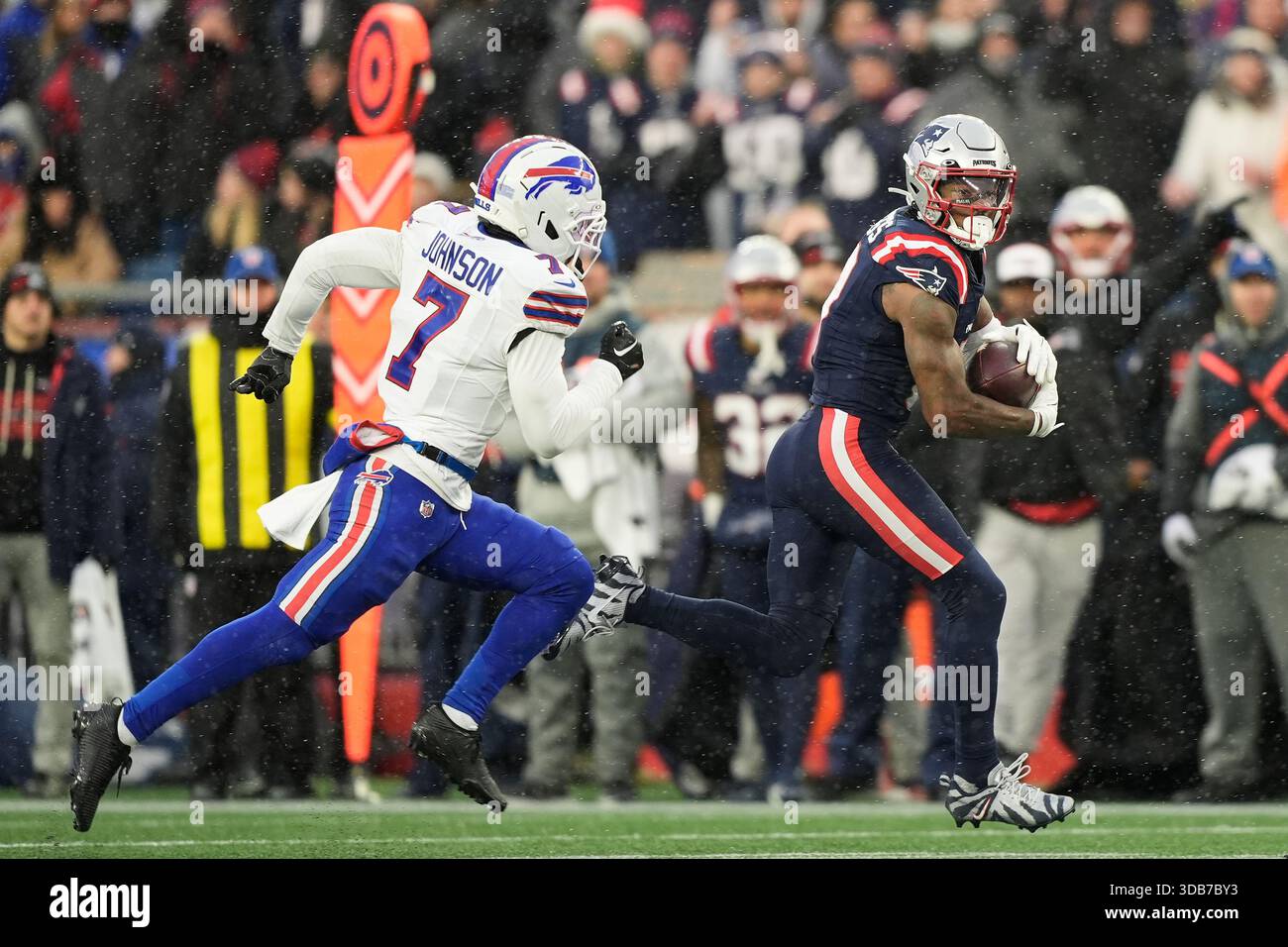 New England Patriots wide receiver Stefon Diggs, right, runs against ...