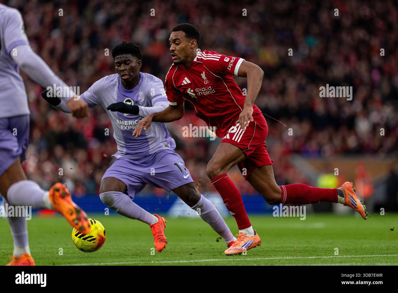 Liverpool's Ryan Gravenberch in action with Carlos Baleba of Brighton ...