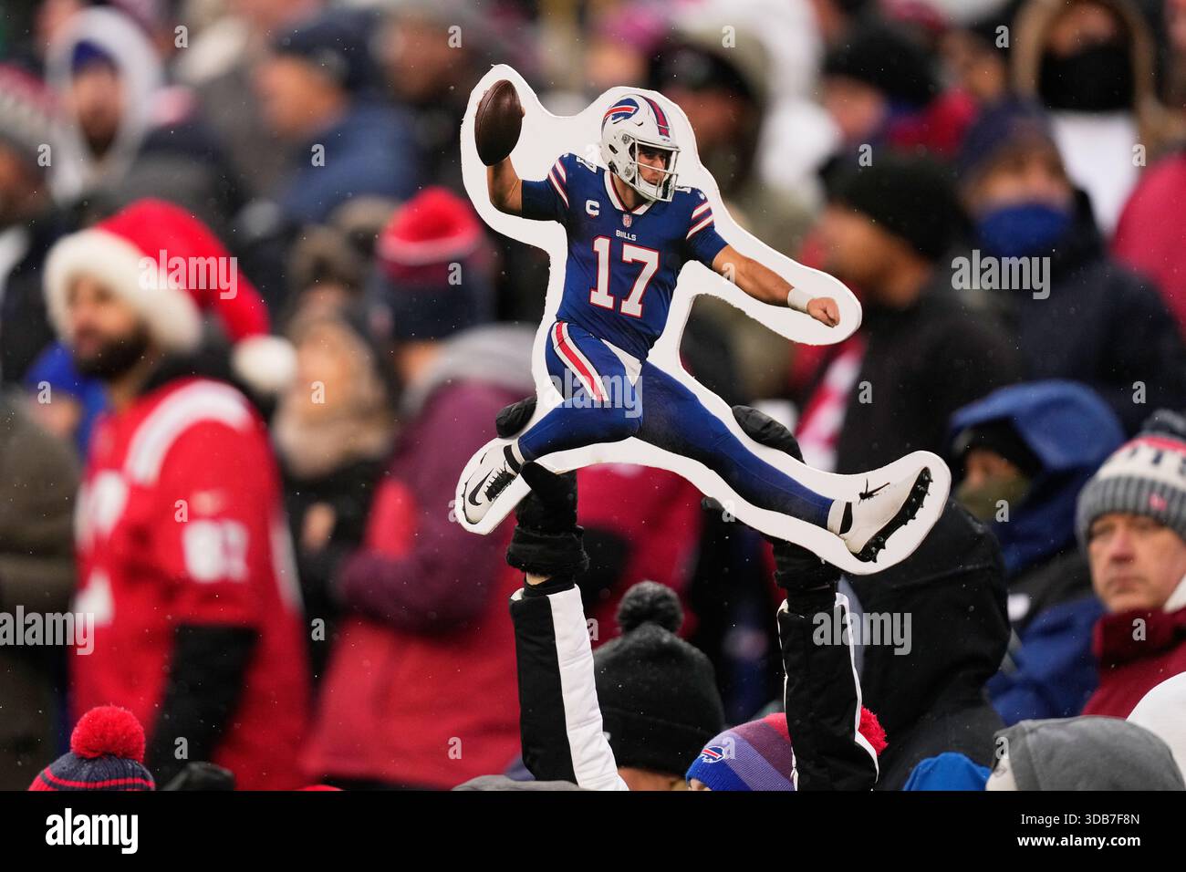 An image of Buffalo Bills quarterback Josh Allen (17) is held up by ...