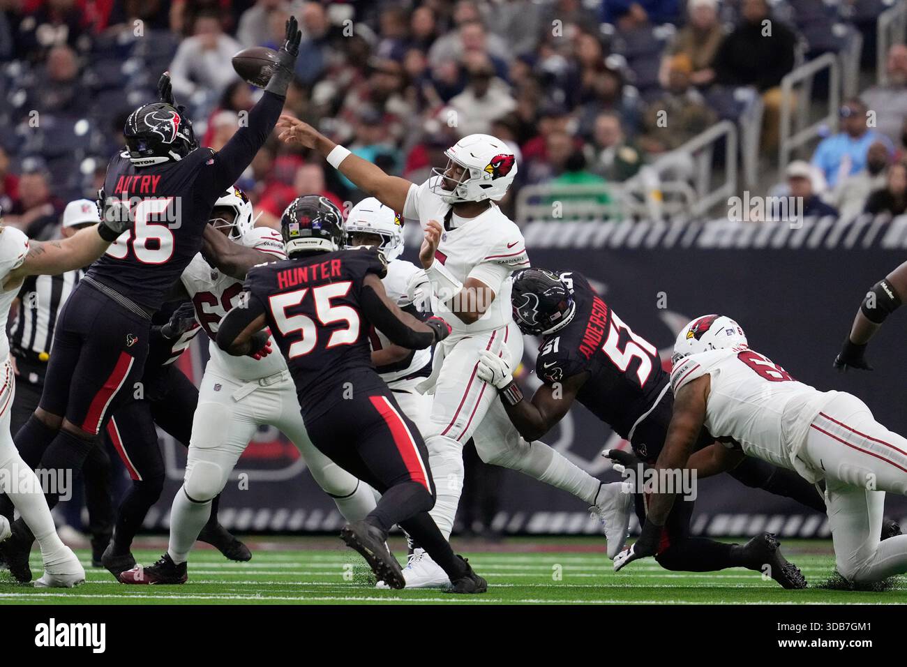 Arizona Cardinals quarterback Jacoby Brissett gets off a pass as he is ...