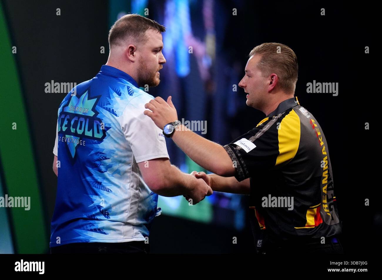 Darren Beveridge (left) celebrates defeating Dimitri Van den Bergh on ...