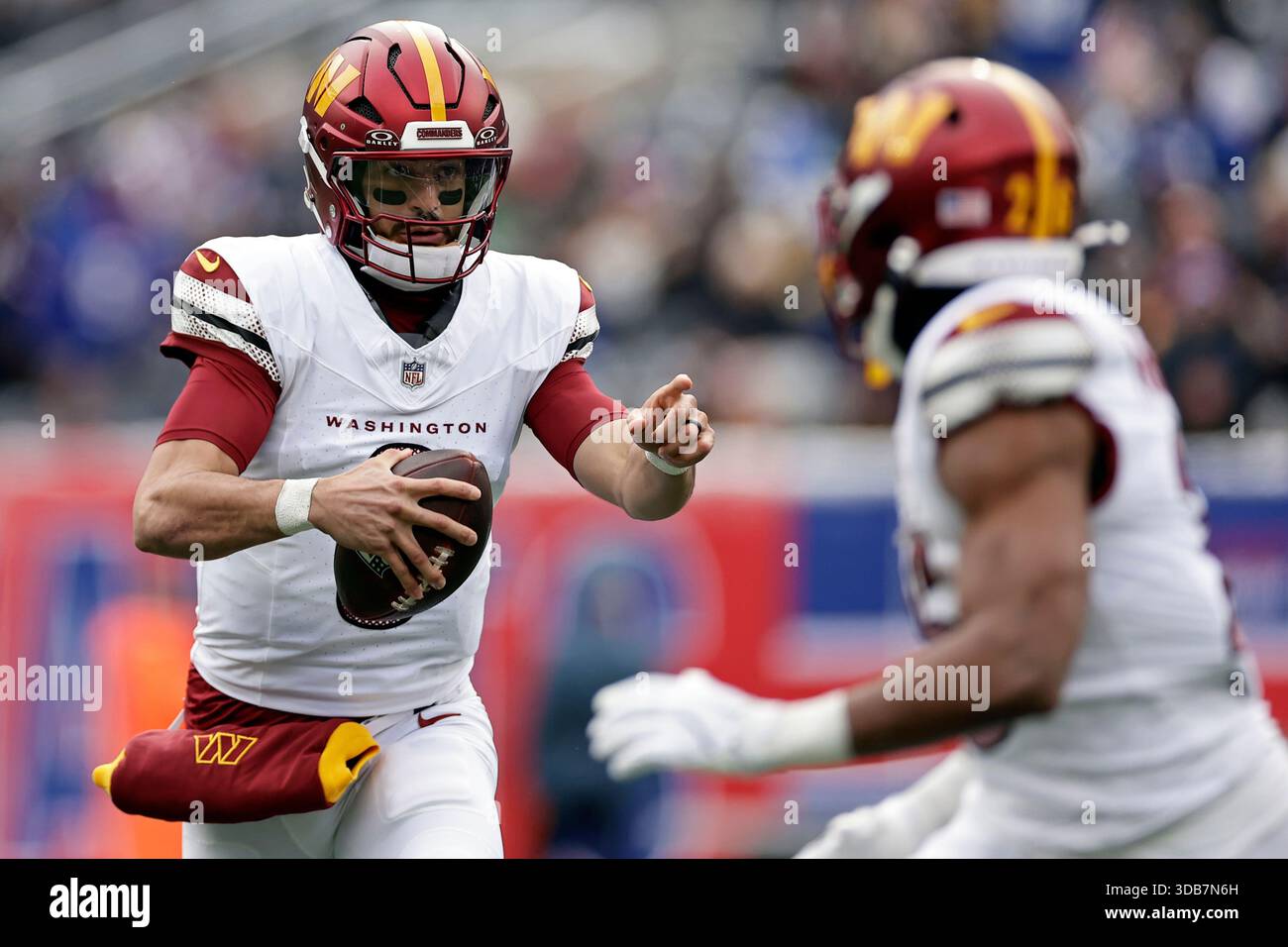 Washington Commanders quarterback Marcus Mariota (8) runs with the ball ...