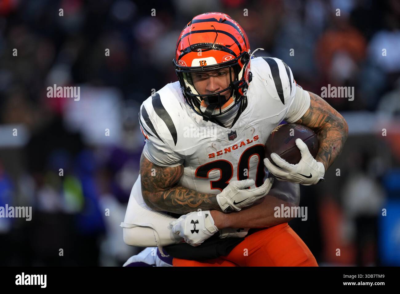 Cincinnati Bengals running back Chase Brown (30) is tackled by ...