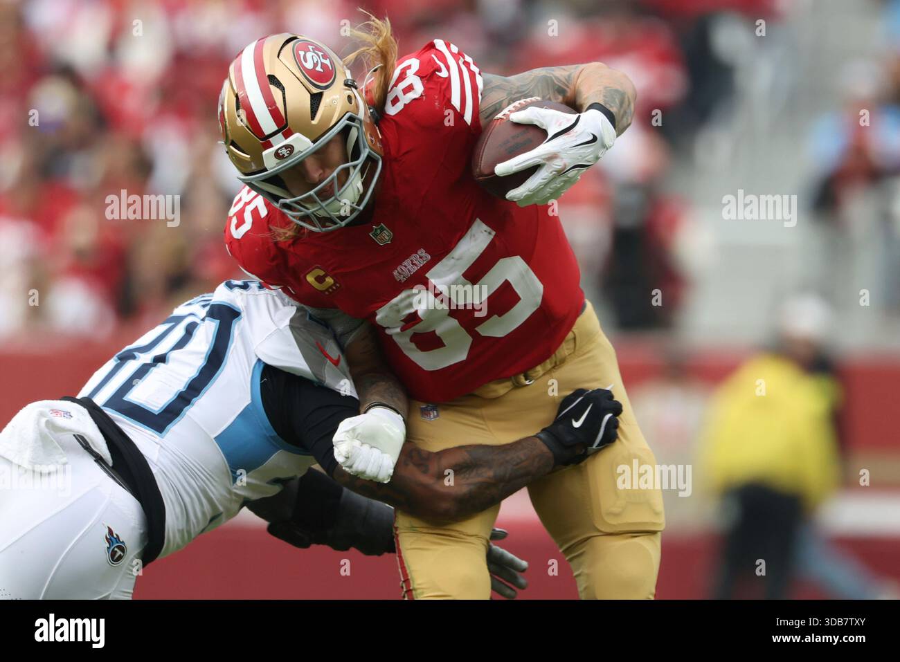 San Francisco 49ers tight end George Kittle (85) breaks a tackle by ...