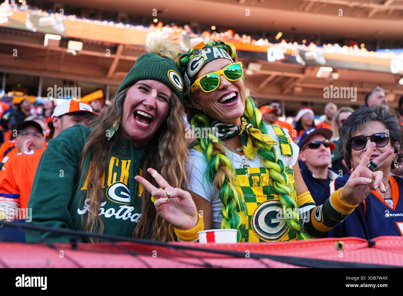 Fans cheer during the first half of an NFL football game between the ...