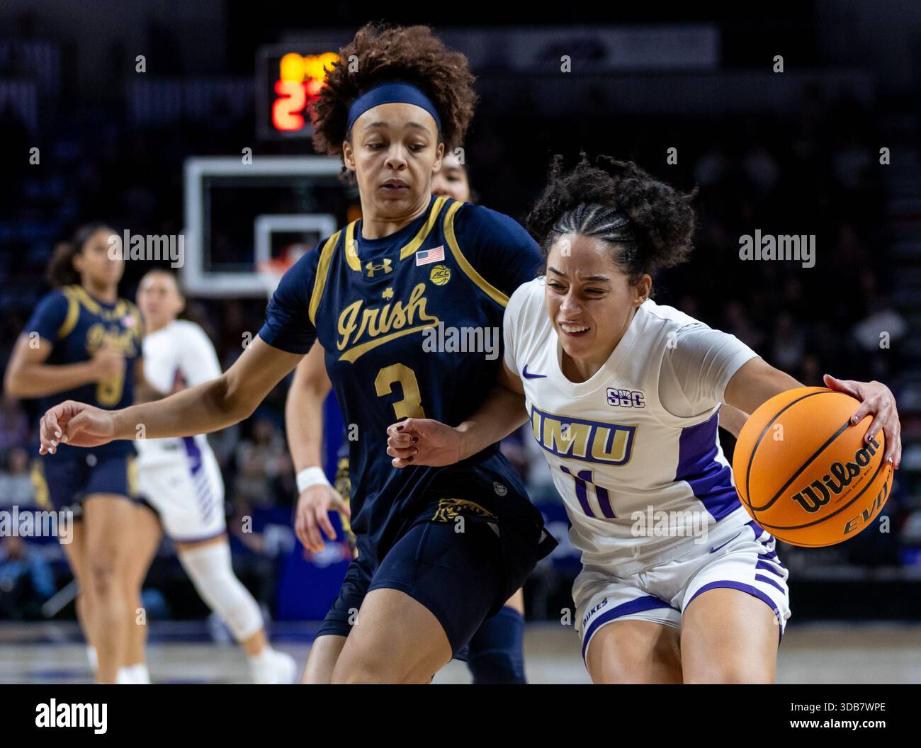 James Madison guard Bree Robinson (11) drives to the basket against ...