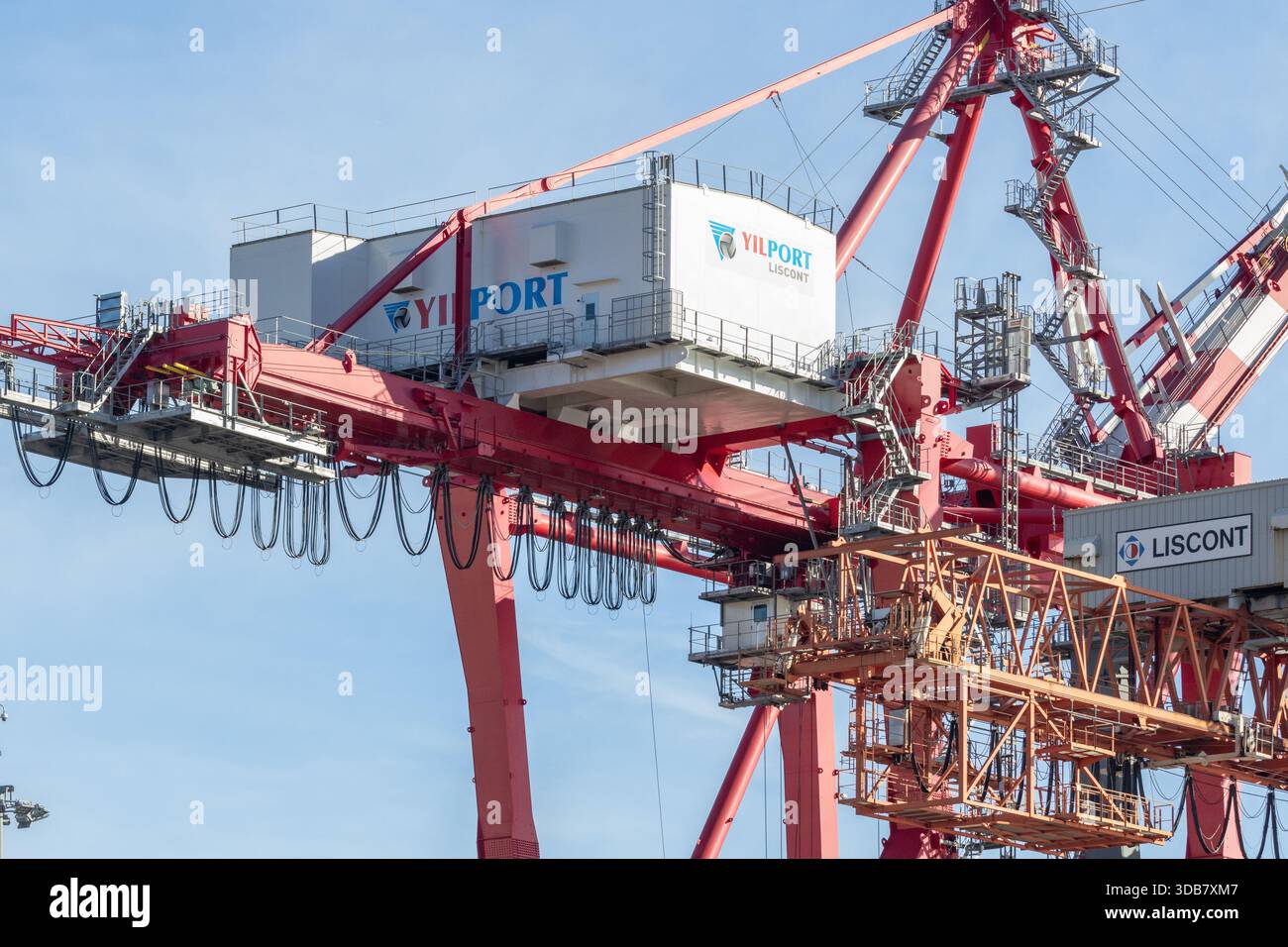 Industrial port crane managing container cargo operations at alcantara ...