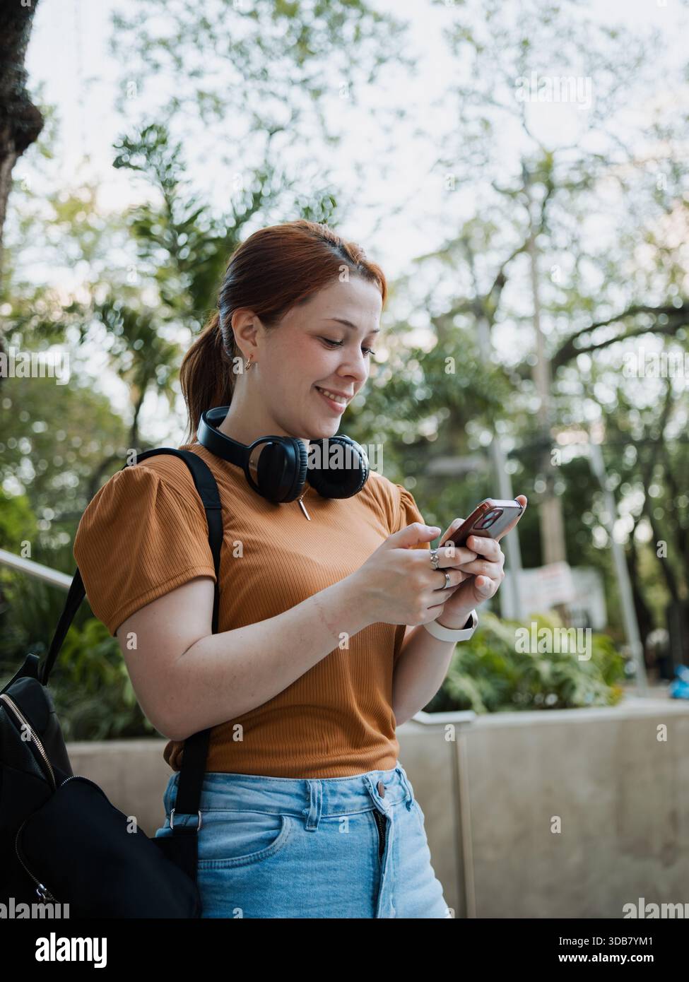 Young woman checks messages hi-res stock photography and images - Alamy