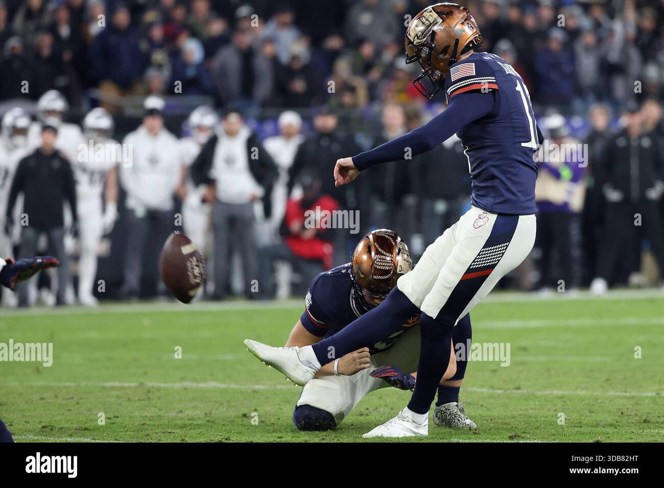 Navy kicker Nathan Kirkwood kicks the ball during the second half of an ...