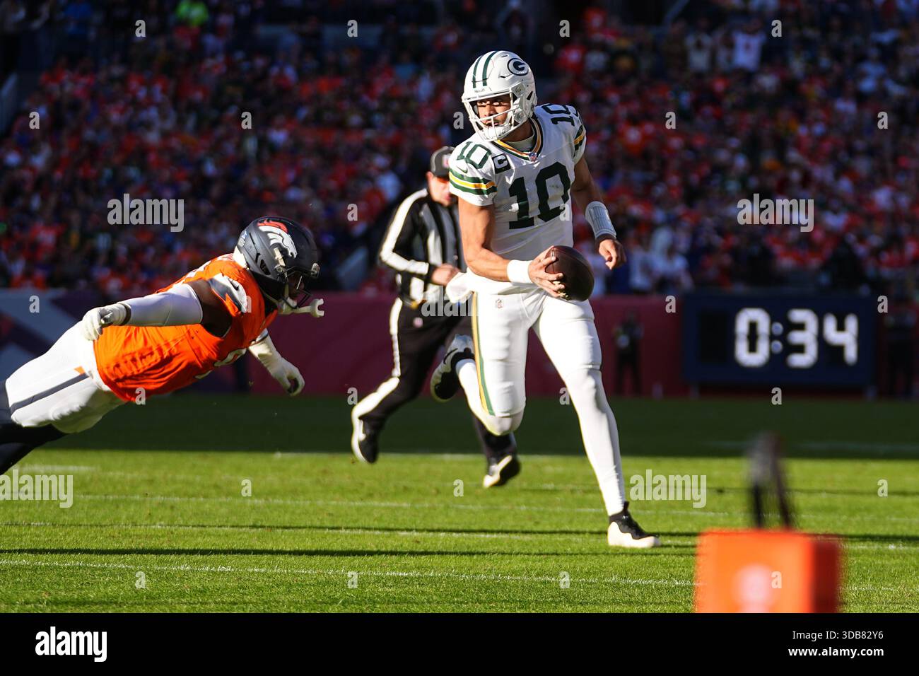 Green Bay Packers quarterback Jordan Love (10) runs the football ...
