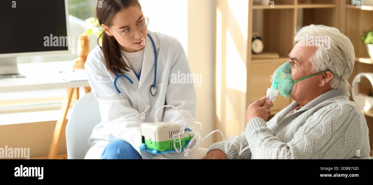 Nurse helping elderly man with oxygen hi-res stock photography and ...