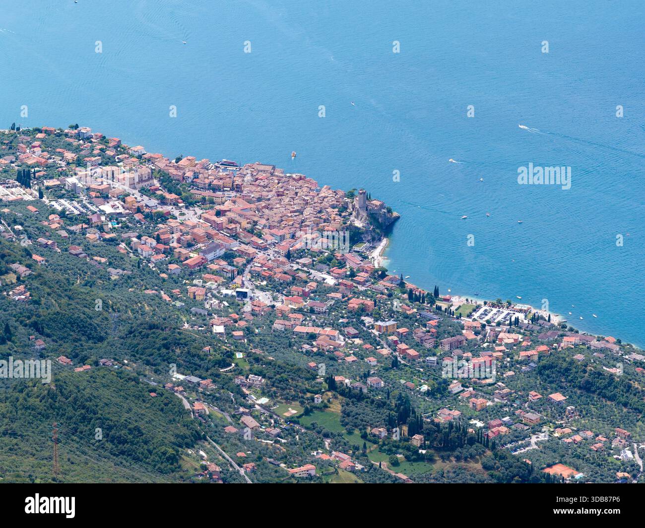 High aerial view of Malcesine’s dense lakeside roofs on Lake Garda ...
