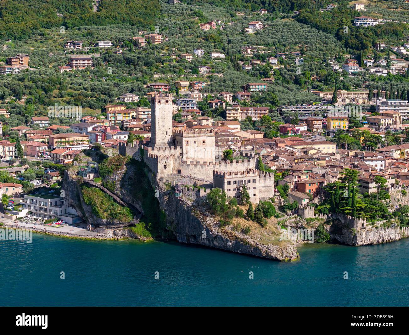 Aerial view of Castello Scaligero, a medieval Scaliger fortress rising ...