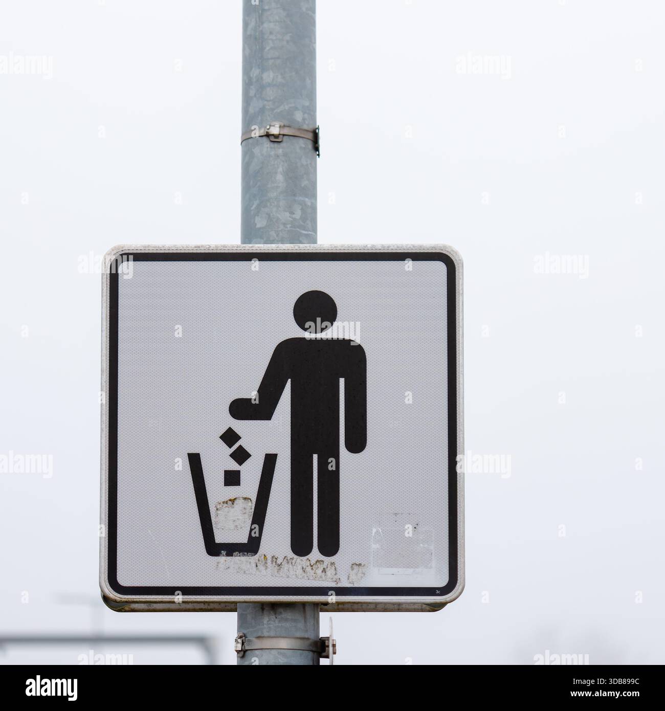 Public notice pictogram showing a person properly disposing of litter ...
