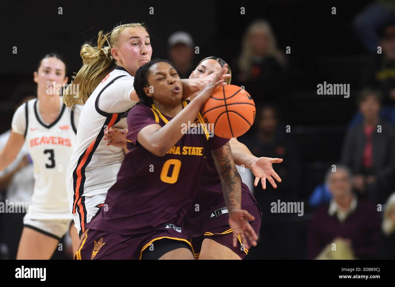 Oregon State center Lizzy Williamson (15) nocks a ball away from ...
