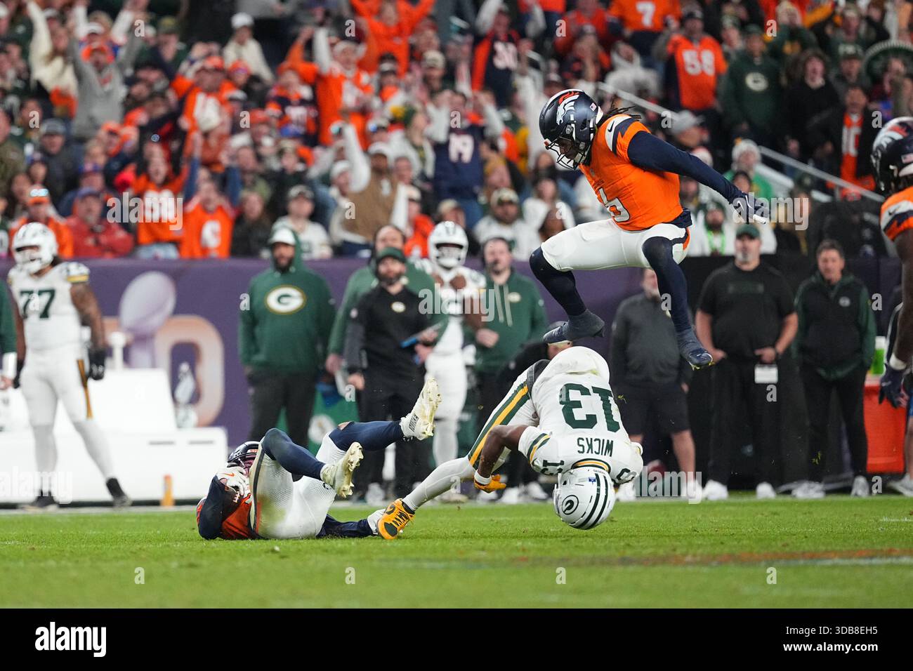 Denver Broncos cornerback Riley Moss (21) makes an interception against ...