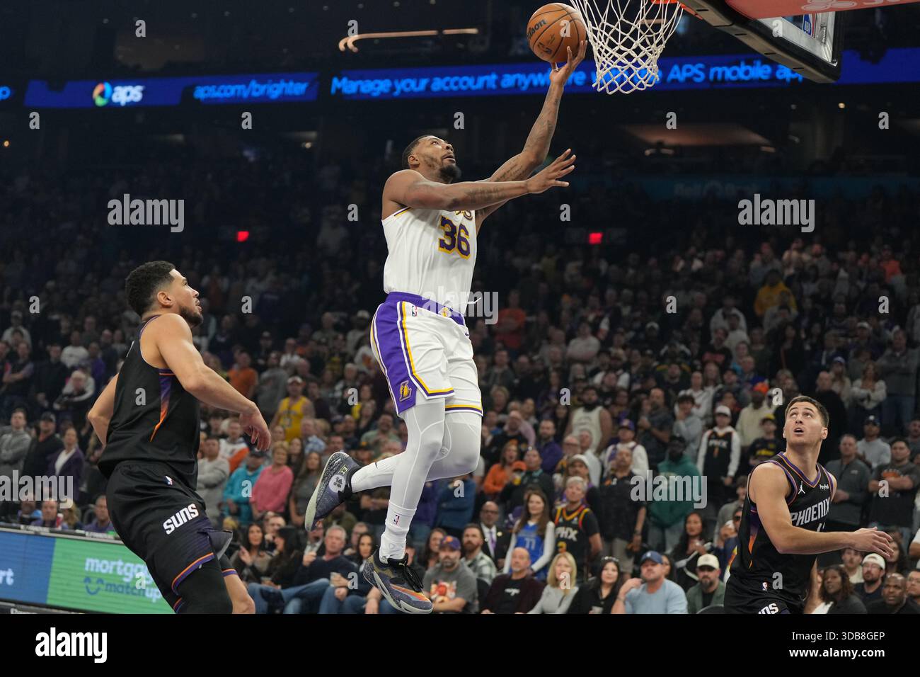 Los Angeles Lakers guard Marcus Smart (36) scores between Phoenix Suns ...