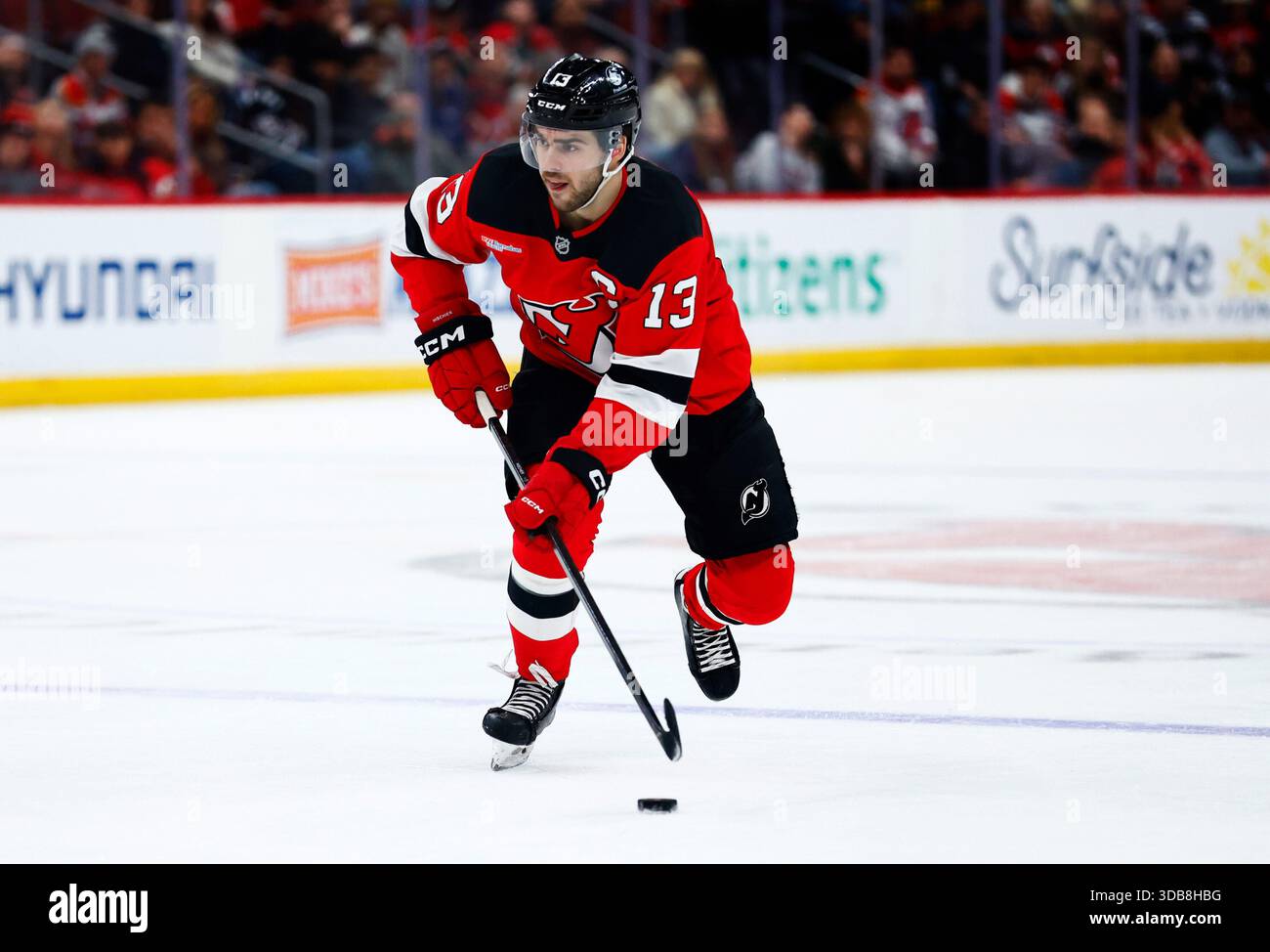 New Jersey Devils center Nico Hischier (13) skates with the puck during ...