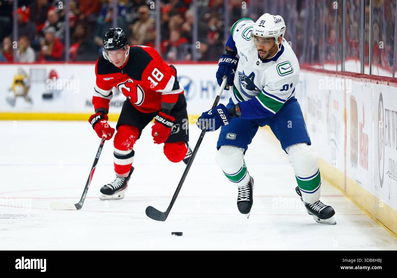 Vancouver Canucks left wing Evander Kane (91) skates with the puck ...