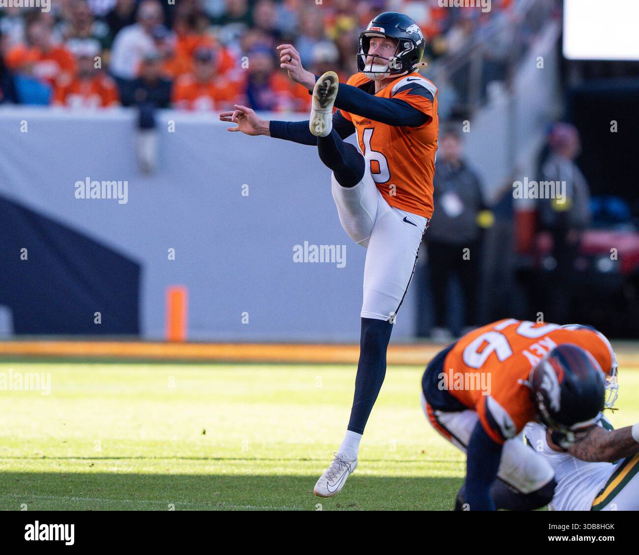 December 14, 2025: Denver Broncos punter Jeremy Crawshaw (16) punts the ...