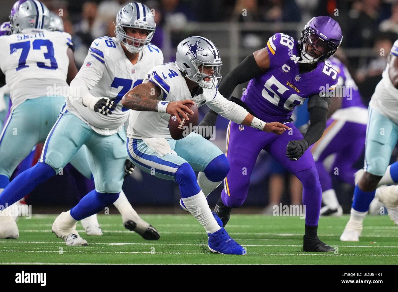 Dallas Cowboys quarterback Dak Prescott, center, scrambles under ...