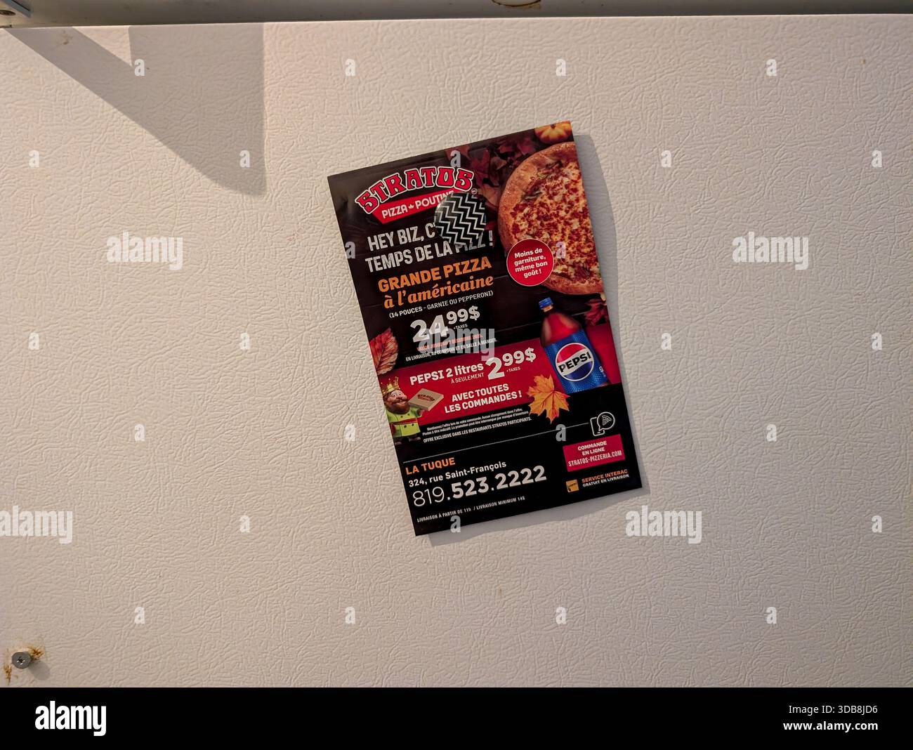 Canada, Quebec, 29 November 2025 : Pizza advertisement on fridge door ...