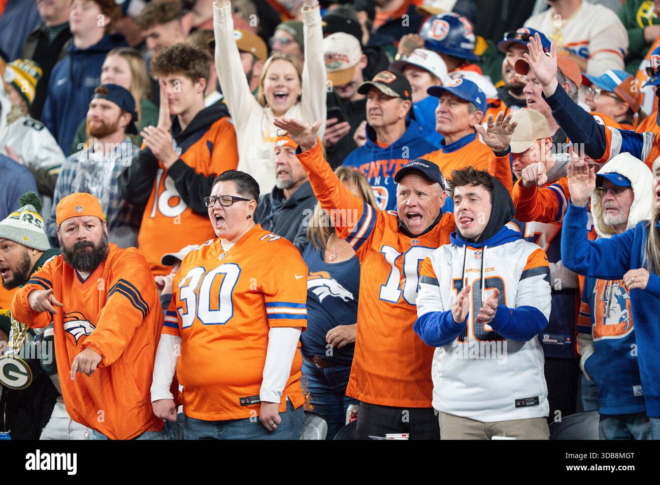 Denver, USA. December 14, 2025: Broncos fans cheer on their team in the ...