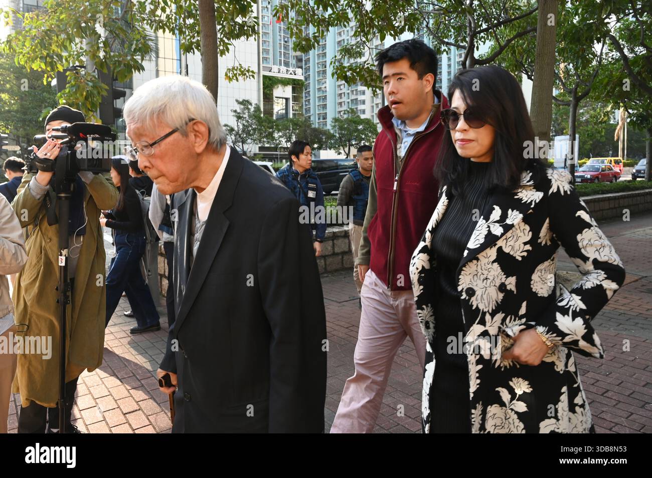 Joseph Zen Ze-Kiun, Jimmy Lai Chee-ying wife Lee Wan Kam and son Lai Shun Yan walking to the ...