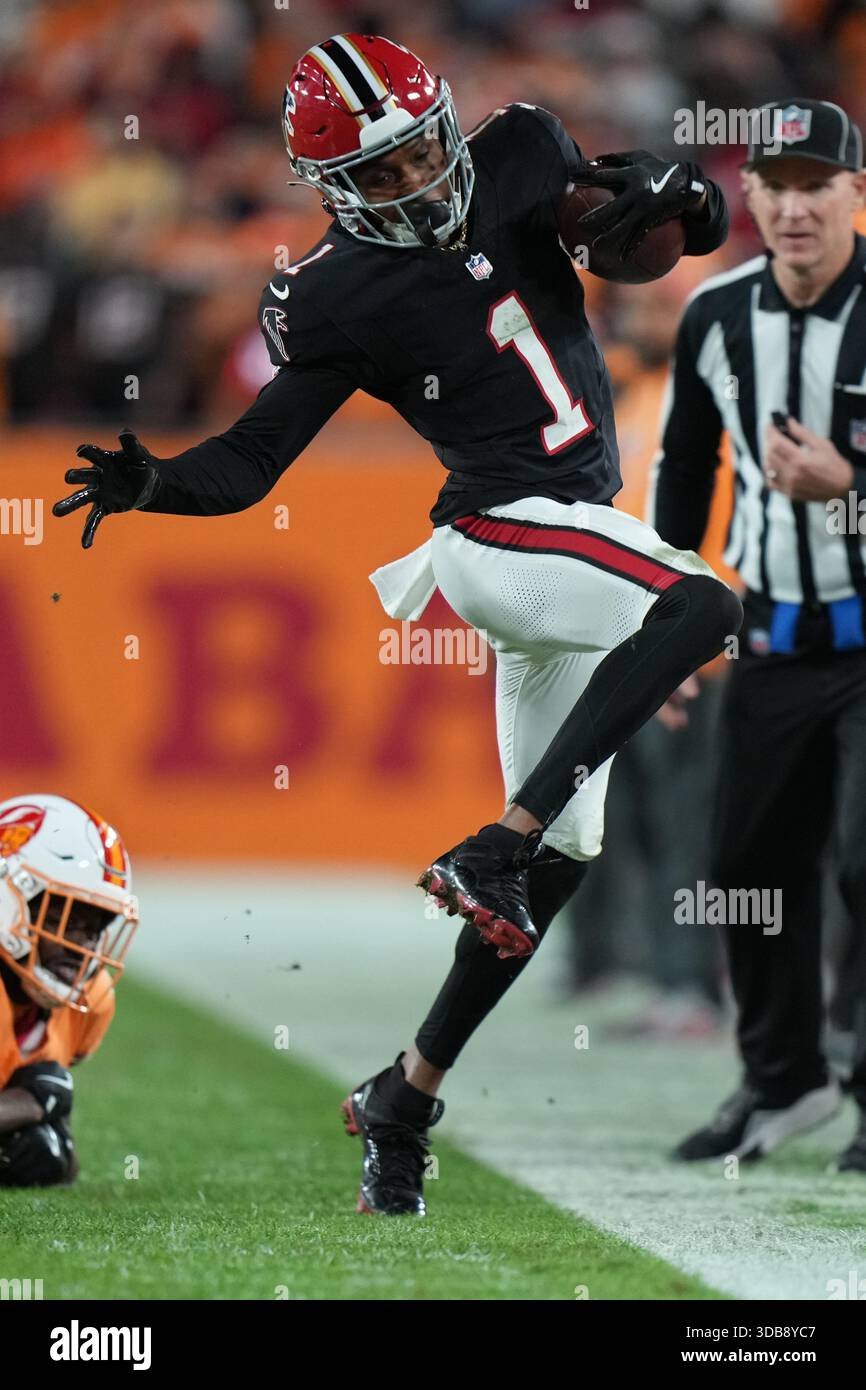 Atlanta Falcons wide receiver Darnell Mooney (1) leaps out of a tackle ...