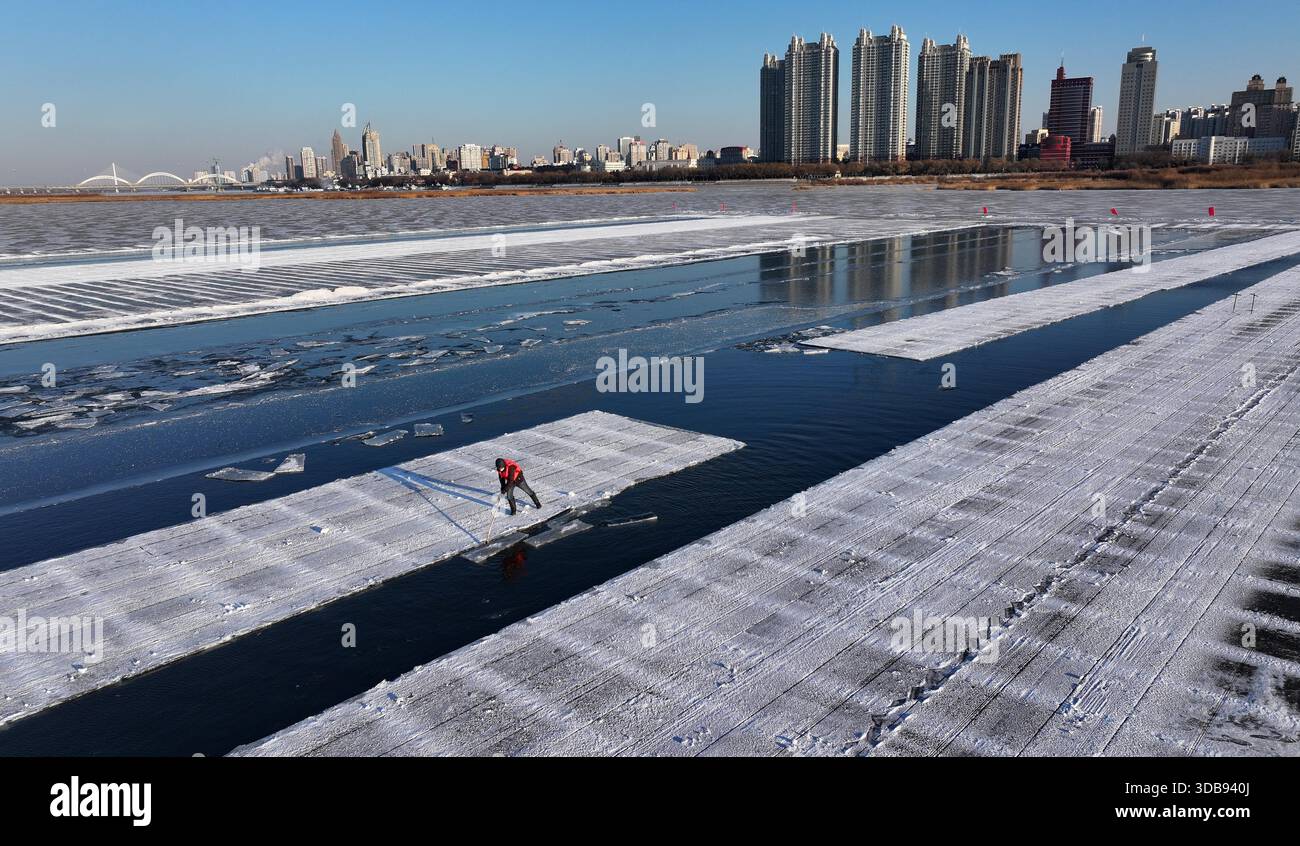 Aerial photo shows workers collecting ice from the Songhua river in ...