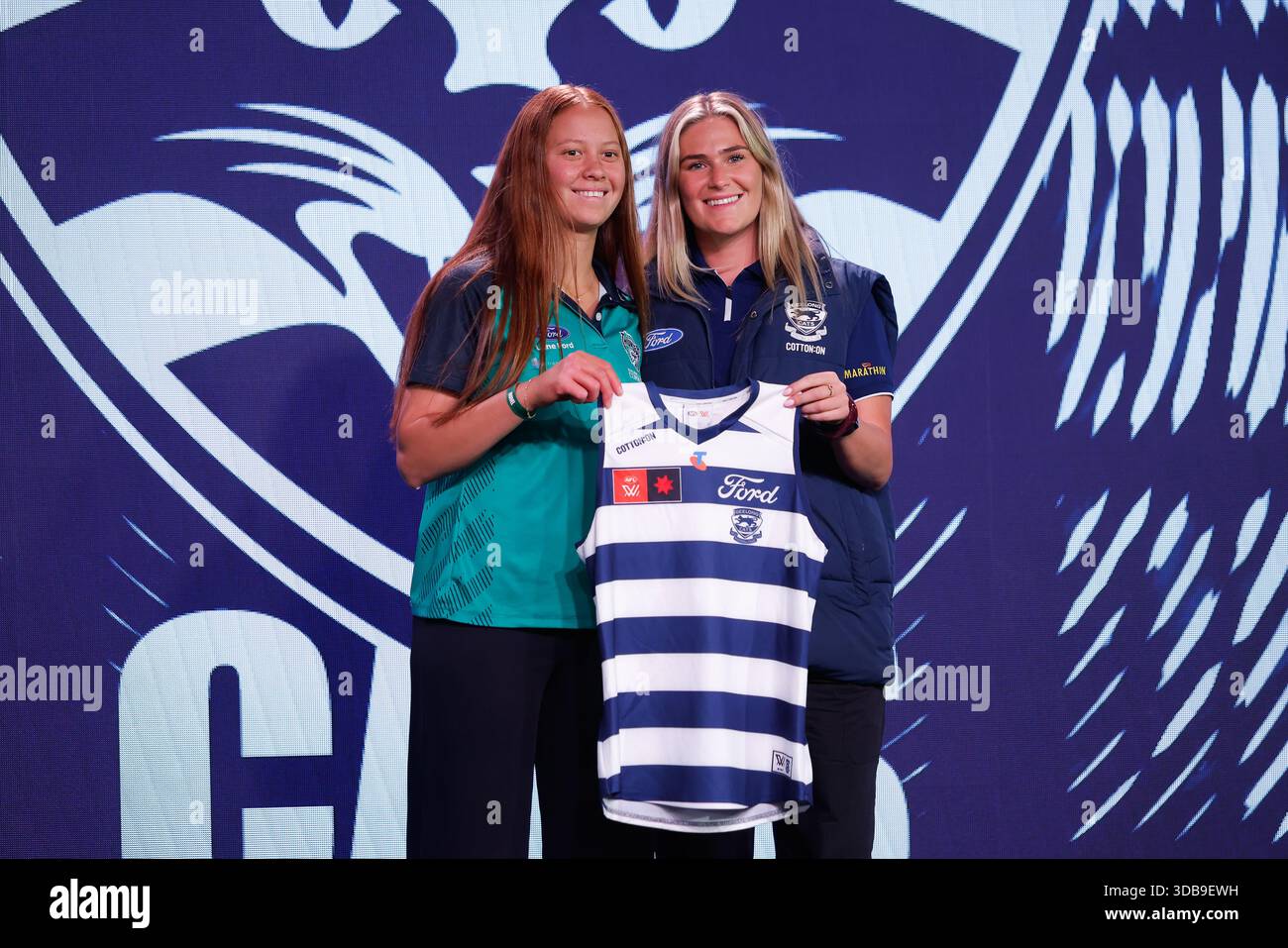 Evie Cowcher of the Peel Thunder is presented with a jumper by Becky ...