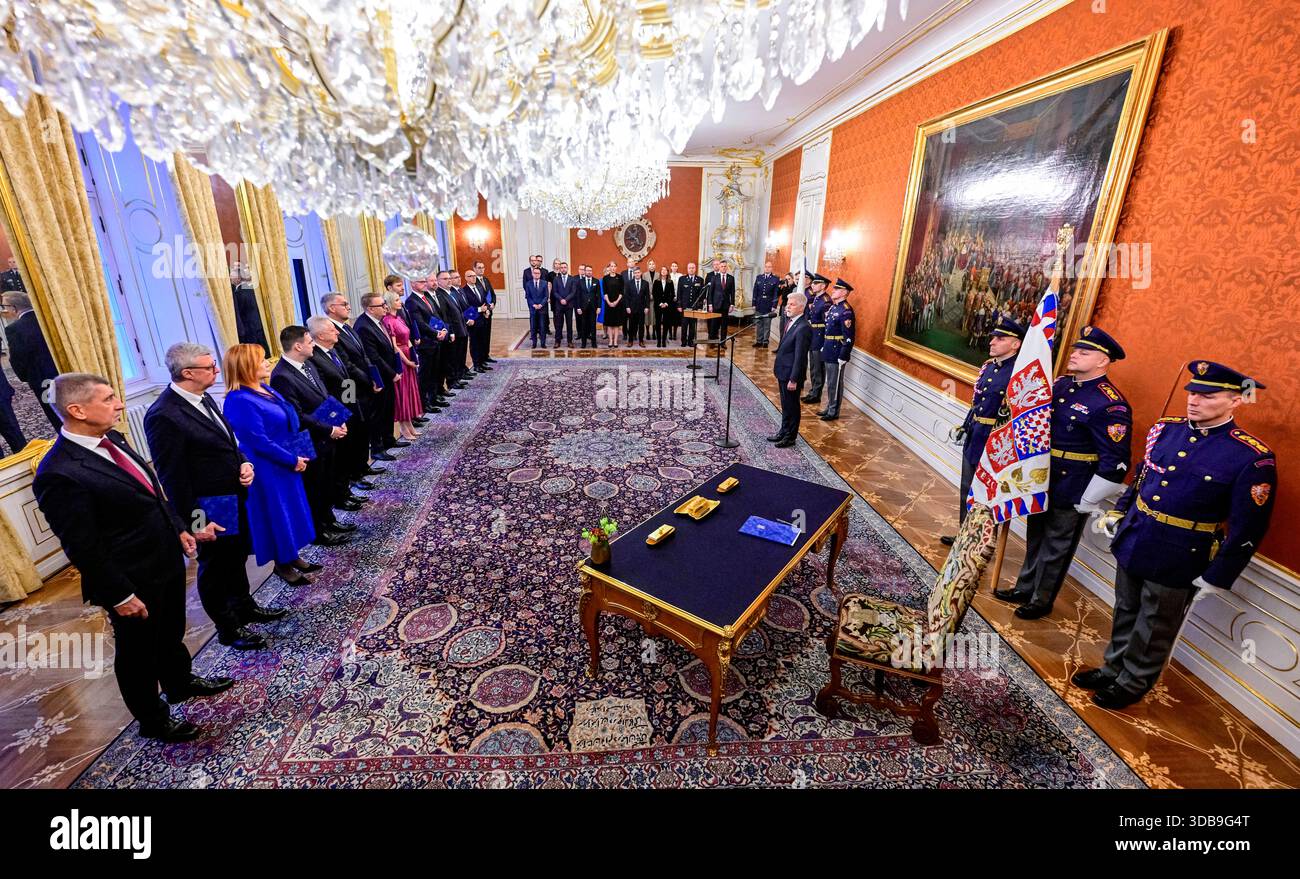 Czech President Petr Pavel (right at the microphone) appoints members ...