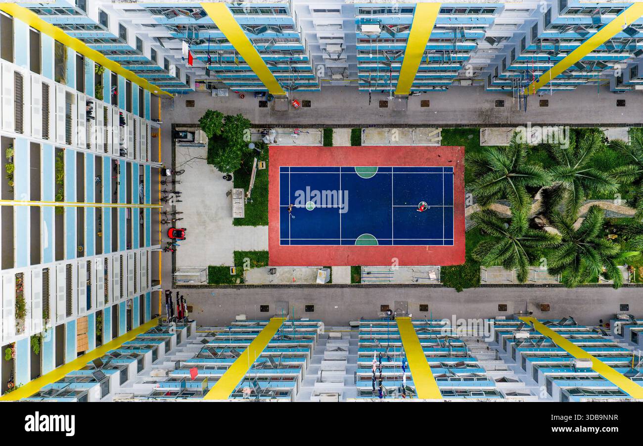 Aerial view of the blue and red badminton sports court nestled between ...