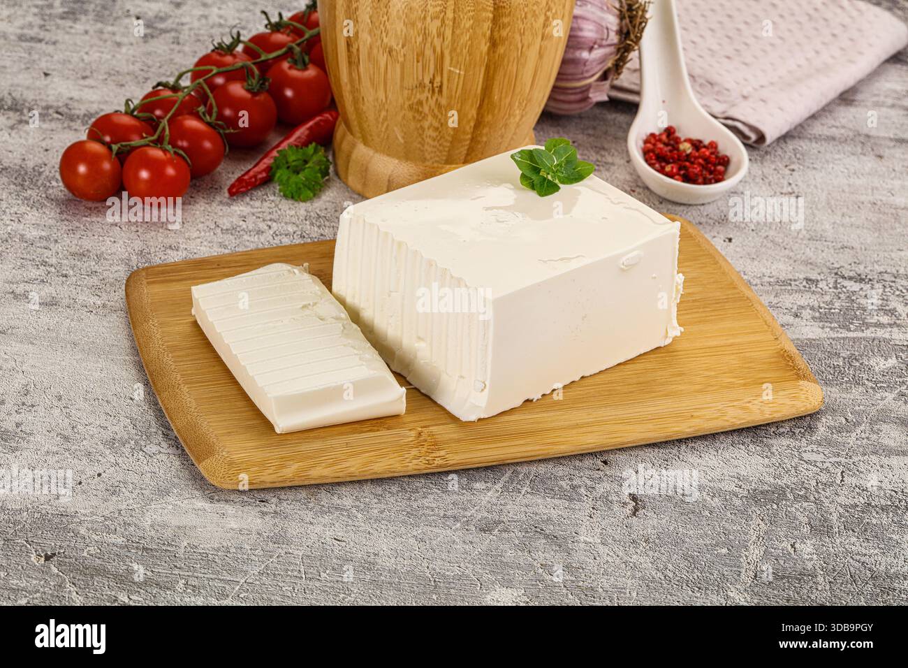 Soft Feta cheese piece with cut snack Stock Photo - Alamy