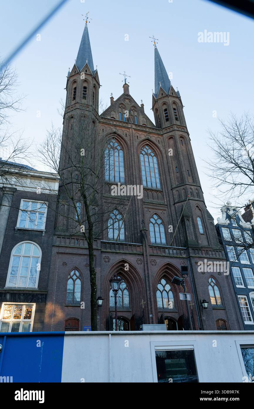 This striking church features twin spires and intricate brickwork ...