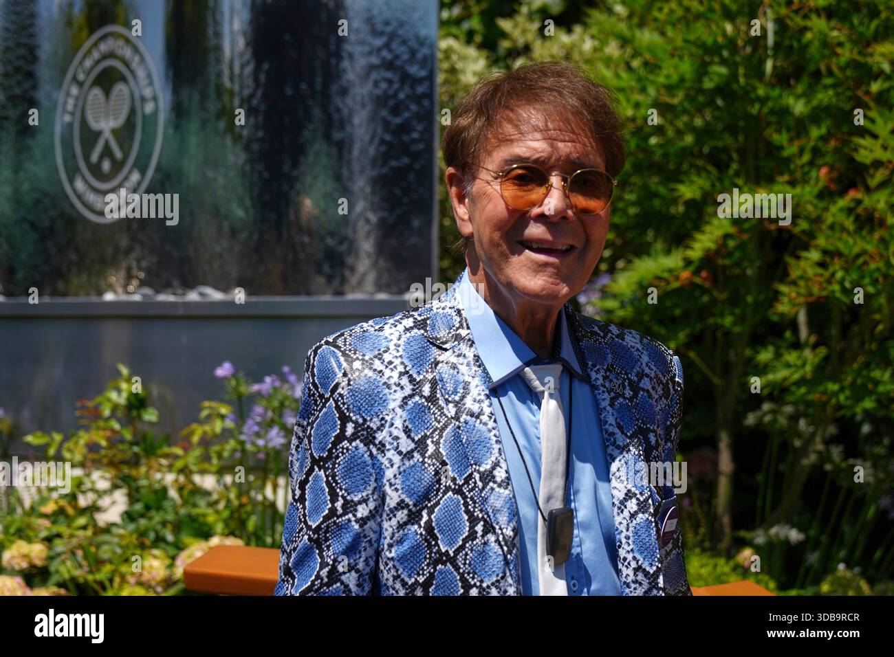 FILE - Singer Cliff Richard poses for a photo as he arrives for day ...