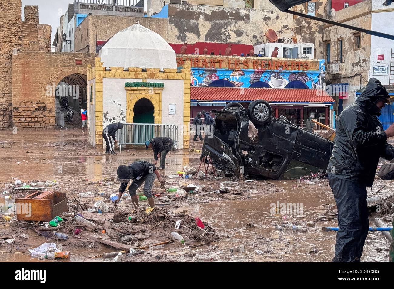 People inspect the damage caused by flash floods in Safi, Morocco ...