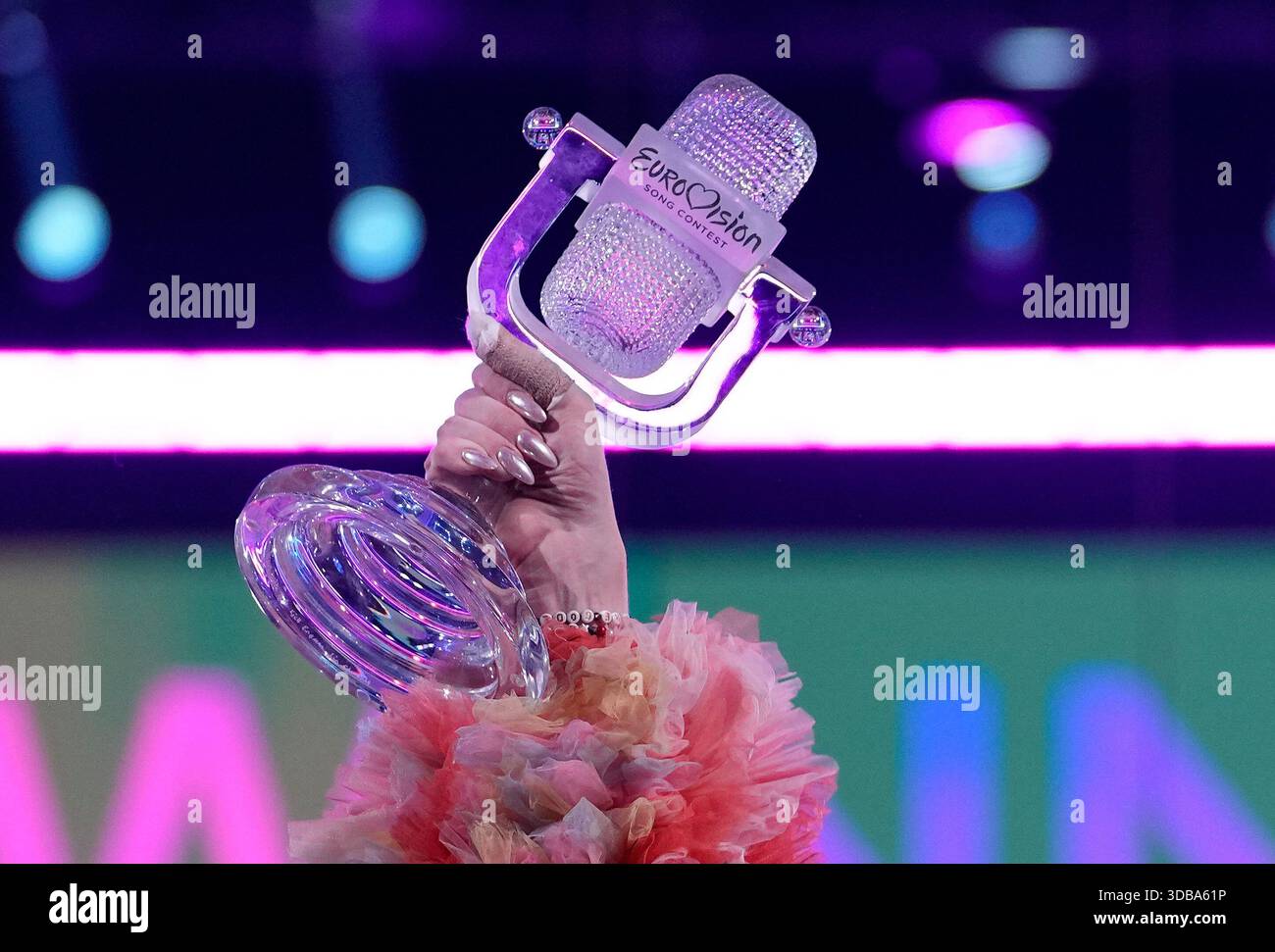 FILE - Nemo of Switzerland, who performed the song The Code, celebrates ...