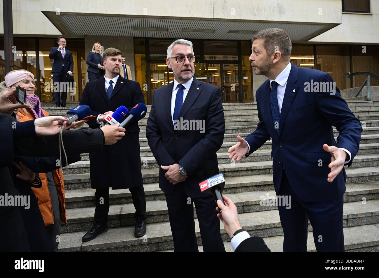 Outgoing Czech Interior Minister Vit Rakusan (STAN; right) speaks to ...