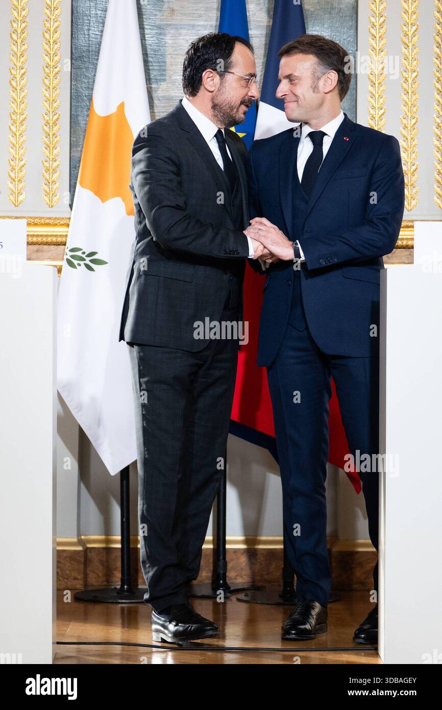 Handshake between French President Emmanuel Macron and Cyprus President ...