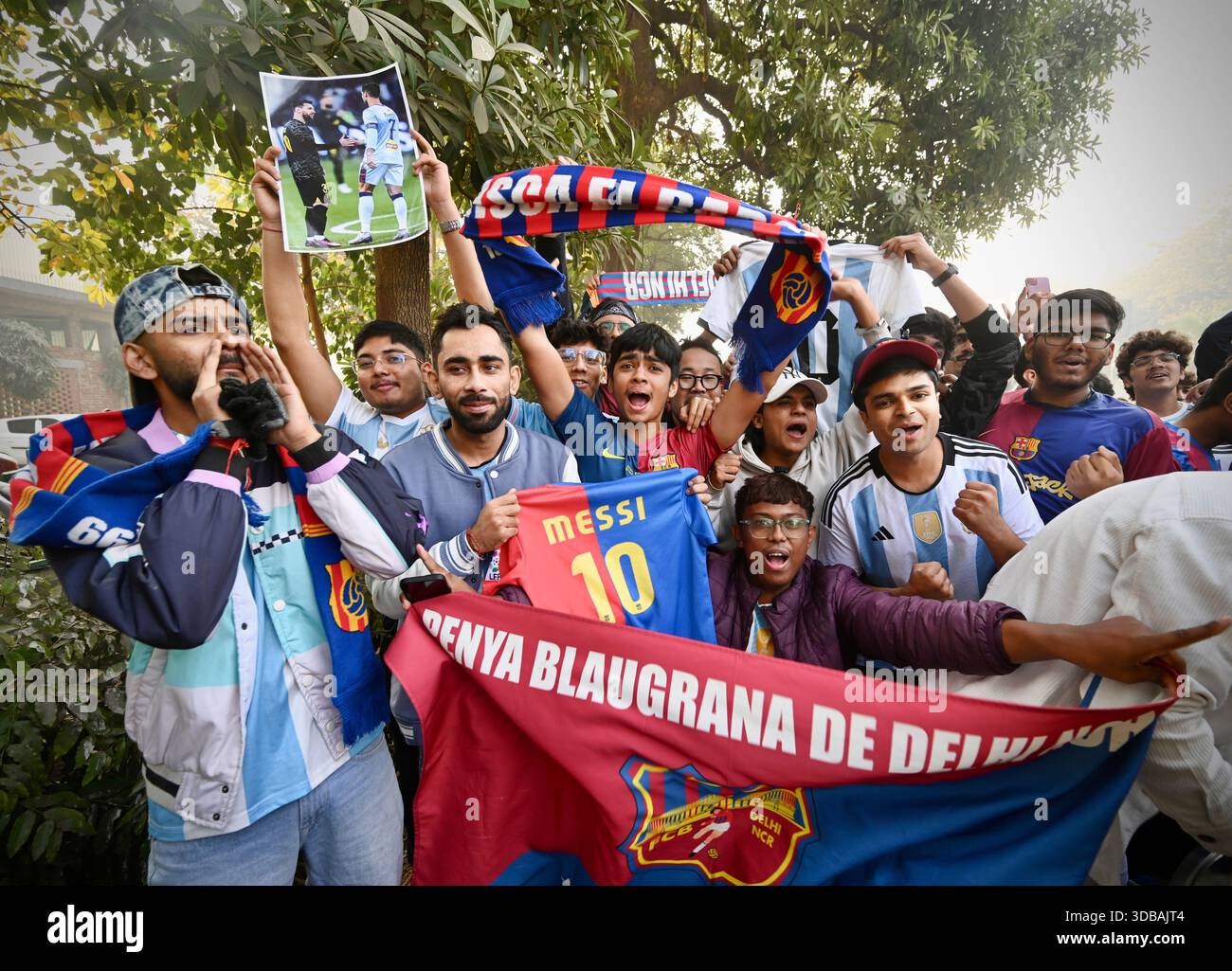 Indian fans of Argentinia's soccer star Lionel Messi react as they wait ...