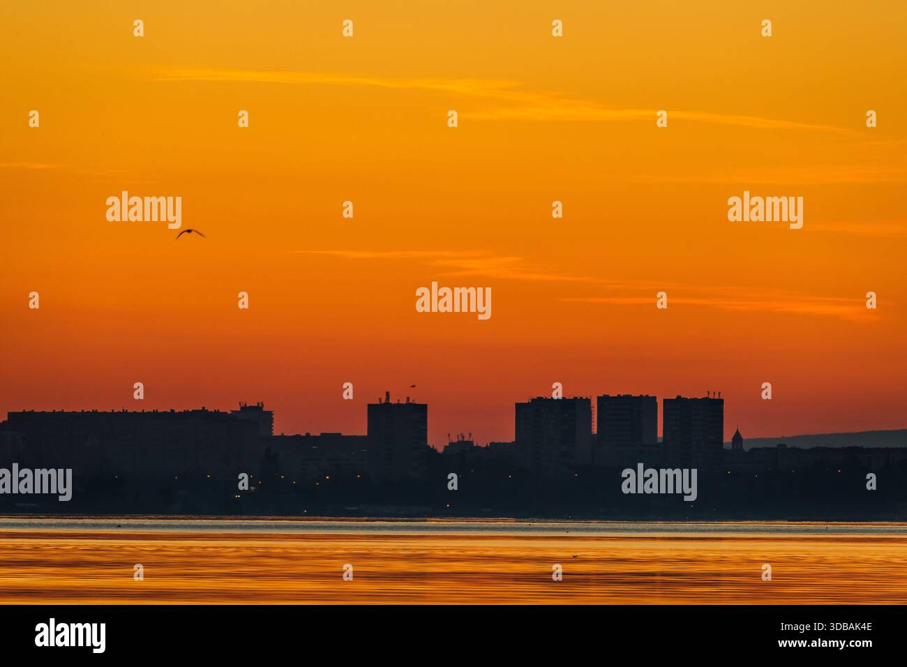 Sun Peaks Above Horizon while painting memorable sunrise over city of ...