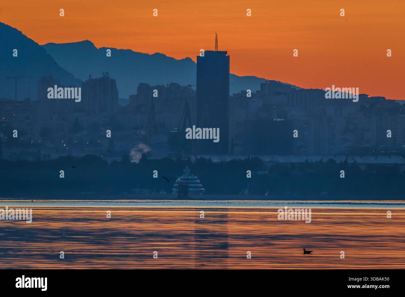 Sun Peaks Above Horizon while painting memorable sunrise over city of ...