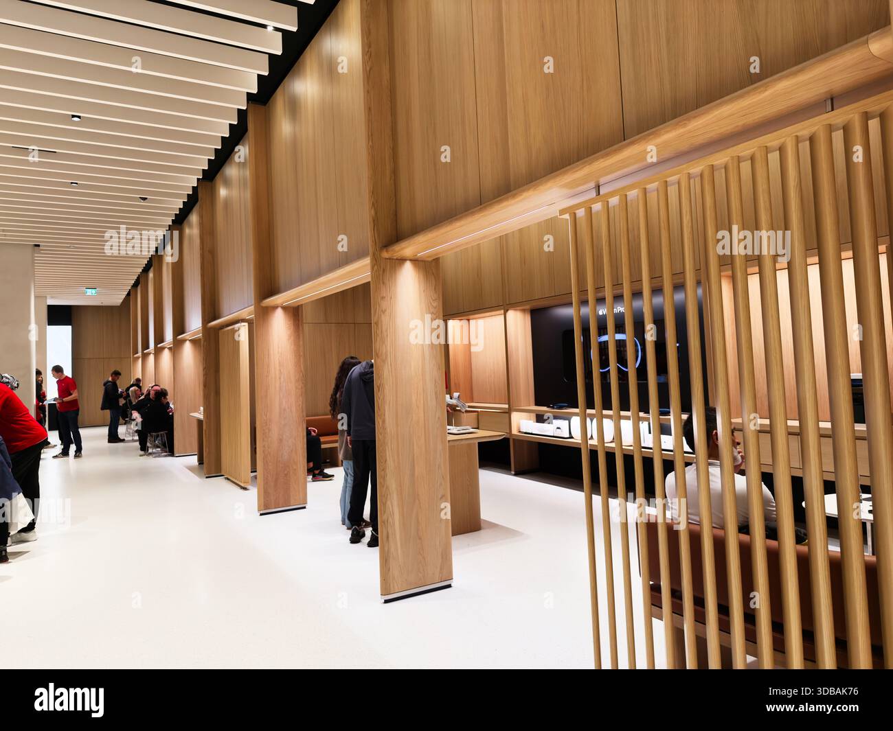 Stretford, UK - November 15, 2025: Bright wood panel Apple lobby in ...