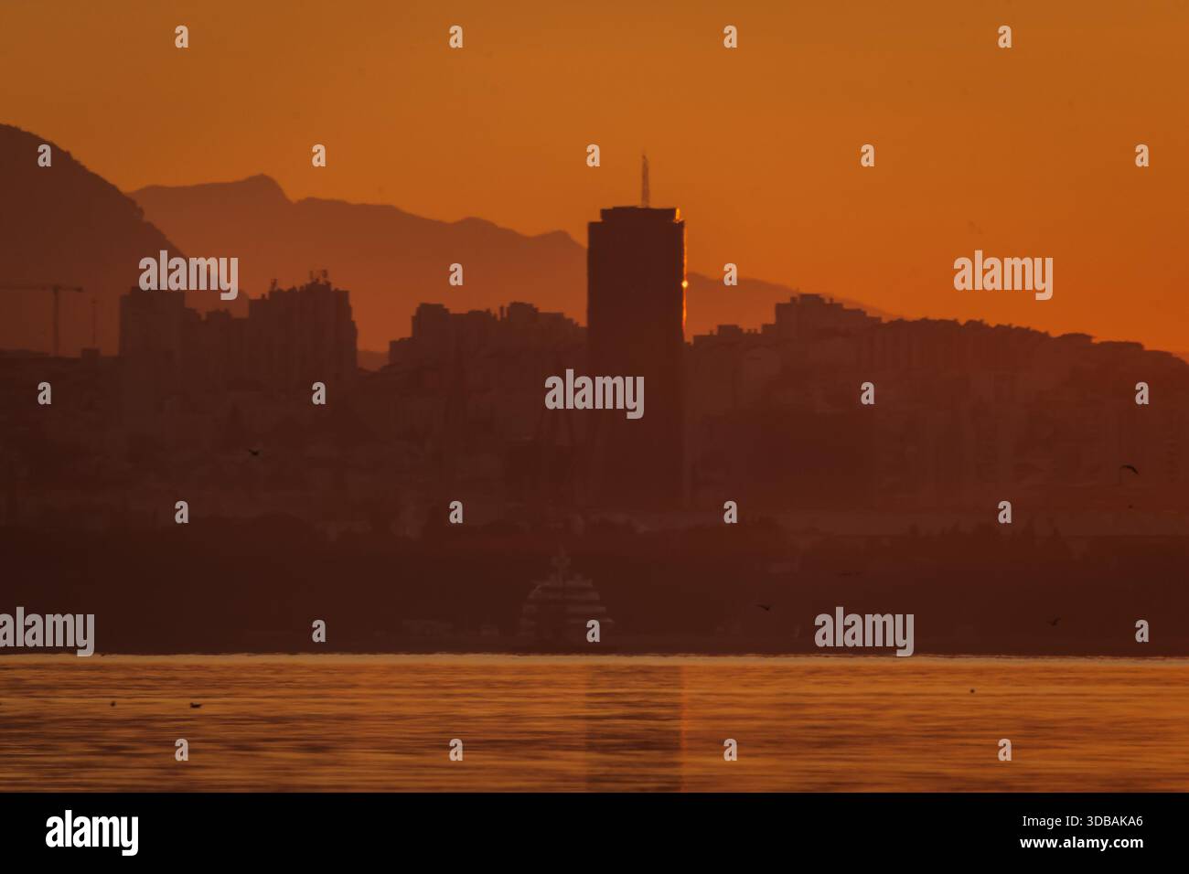 Sun Peaks Above Horizon while painting memorable sunrise over city of ...