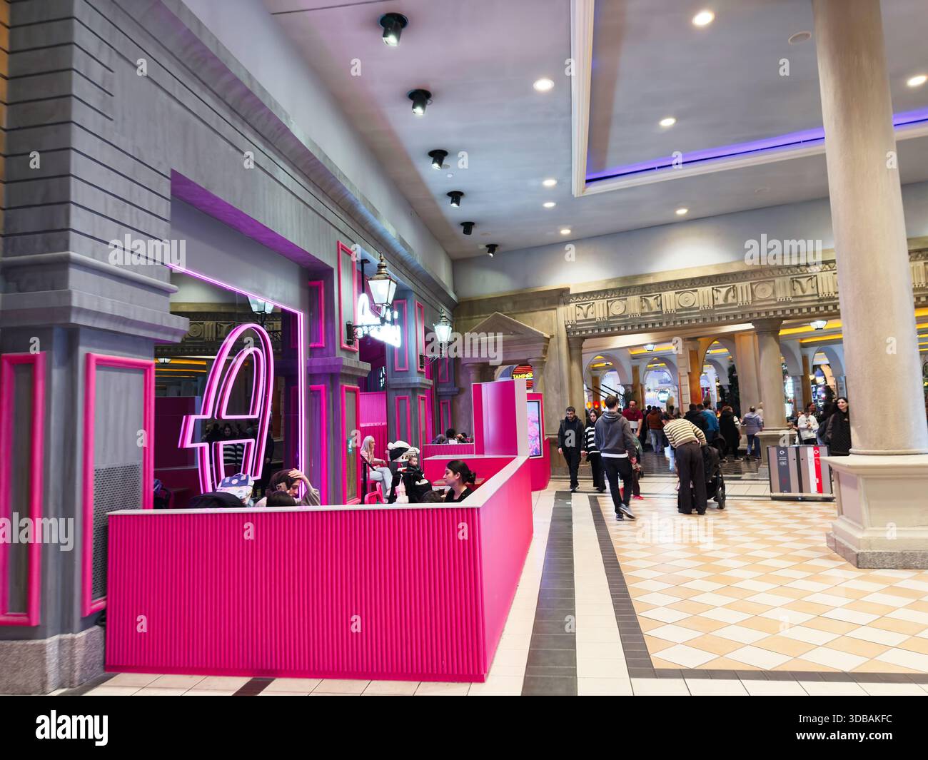 Stretford, UK - November 15, 2025: Bright pink Archie's cafe counter ...